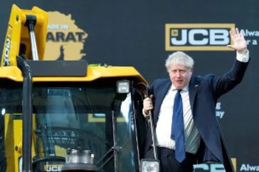 VIJAY UPADHYAY - UK Prime Minister Boris Johnson drives a JCB in ...